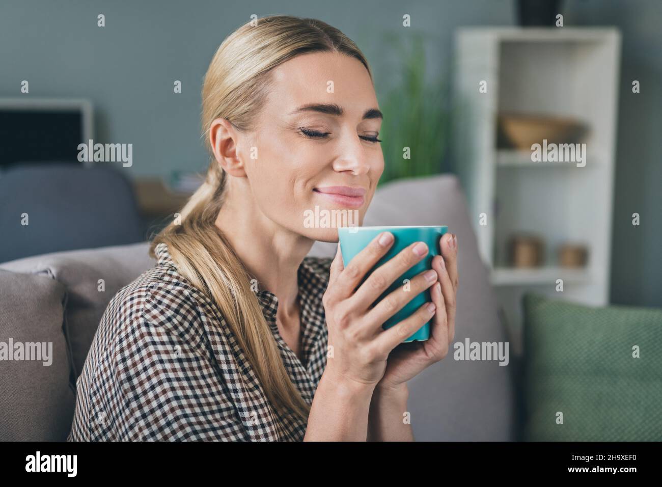 Photo Of Nice Attractive Positive Calm Lady Sit Comfy Divan Smell