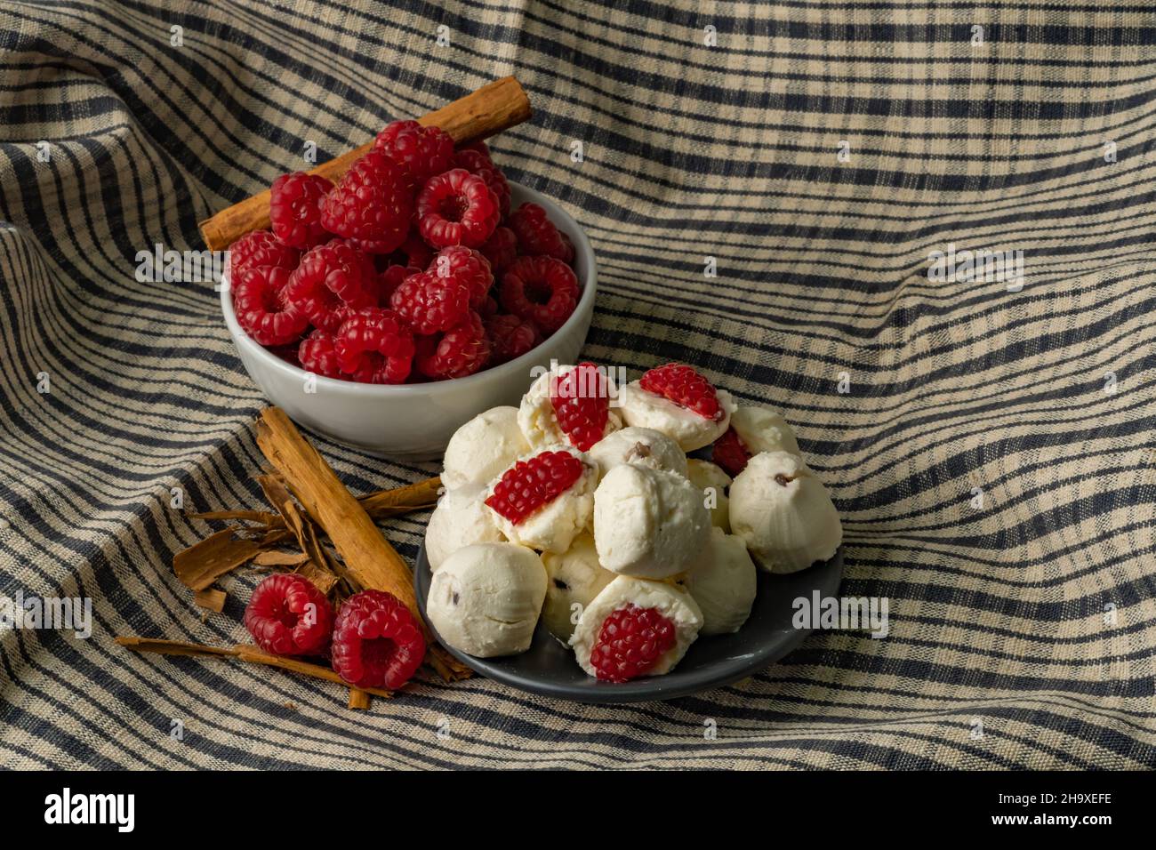 fresh goat cheese balls with raspberries Stock Photo - Alamy