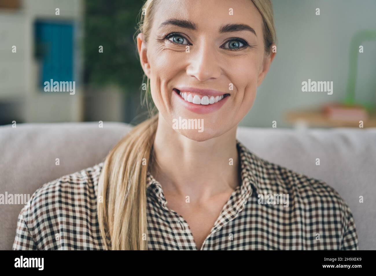 Cropped photo of optimistic pretty nice lady enjoy comfy divan smiling ...