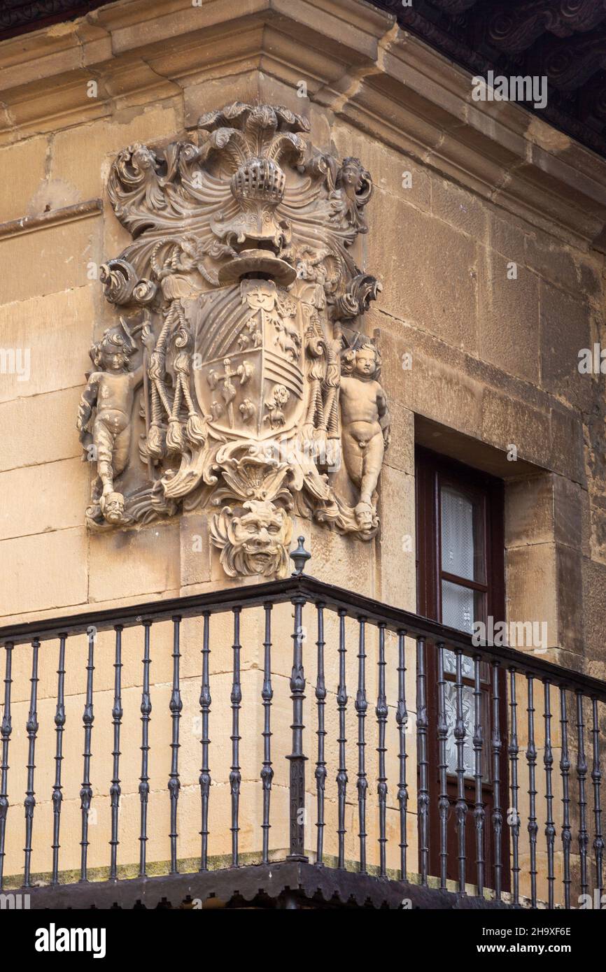 Stonework detail of coat of arms on wall of building, village of ...