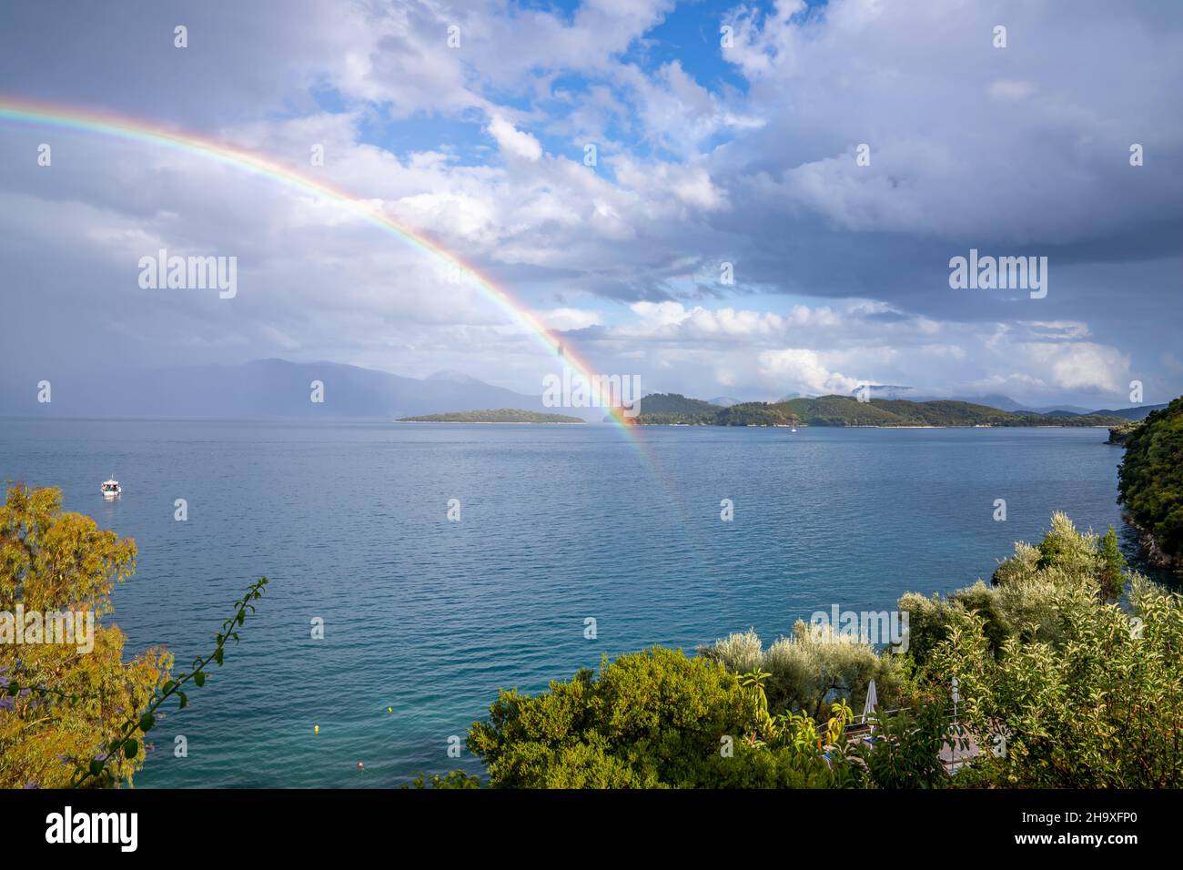 Rainbow over sea Stock Photo - Alamy