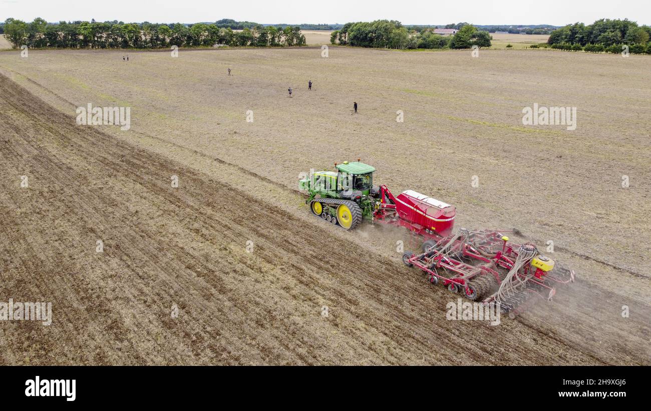 Tractor and metal detectorists Stock Photo - Alamy
