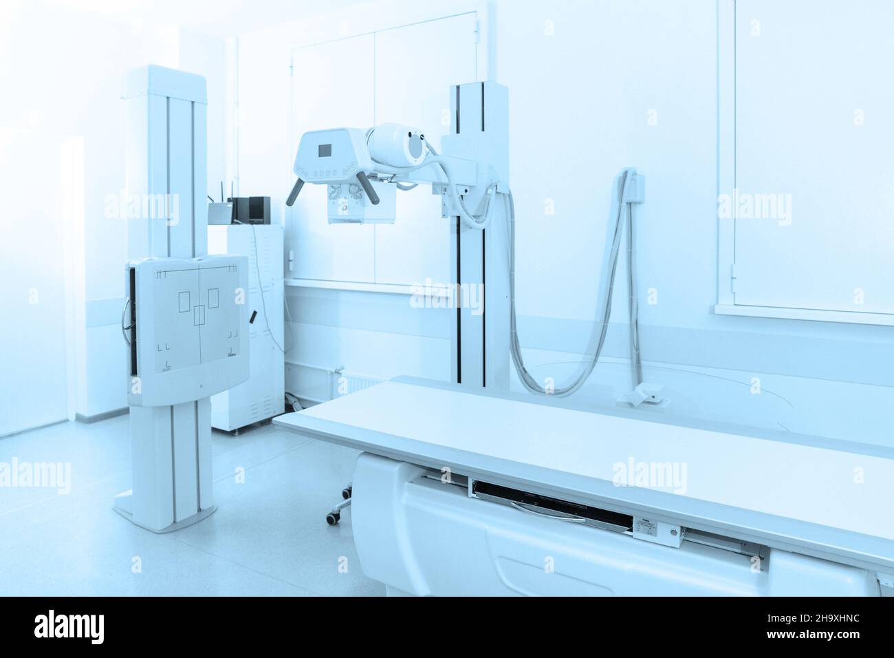 X-ray department in modern hospital. Radiology room with scan machine ...