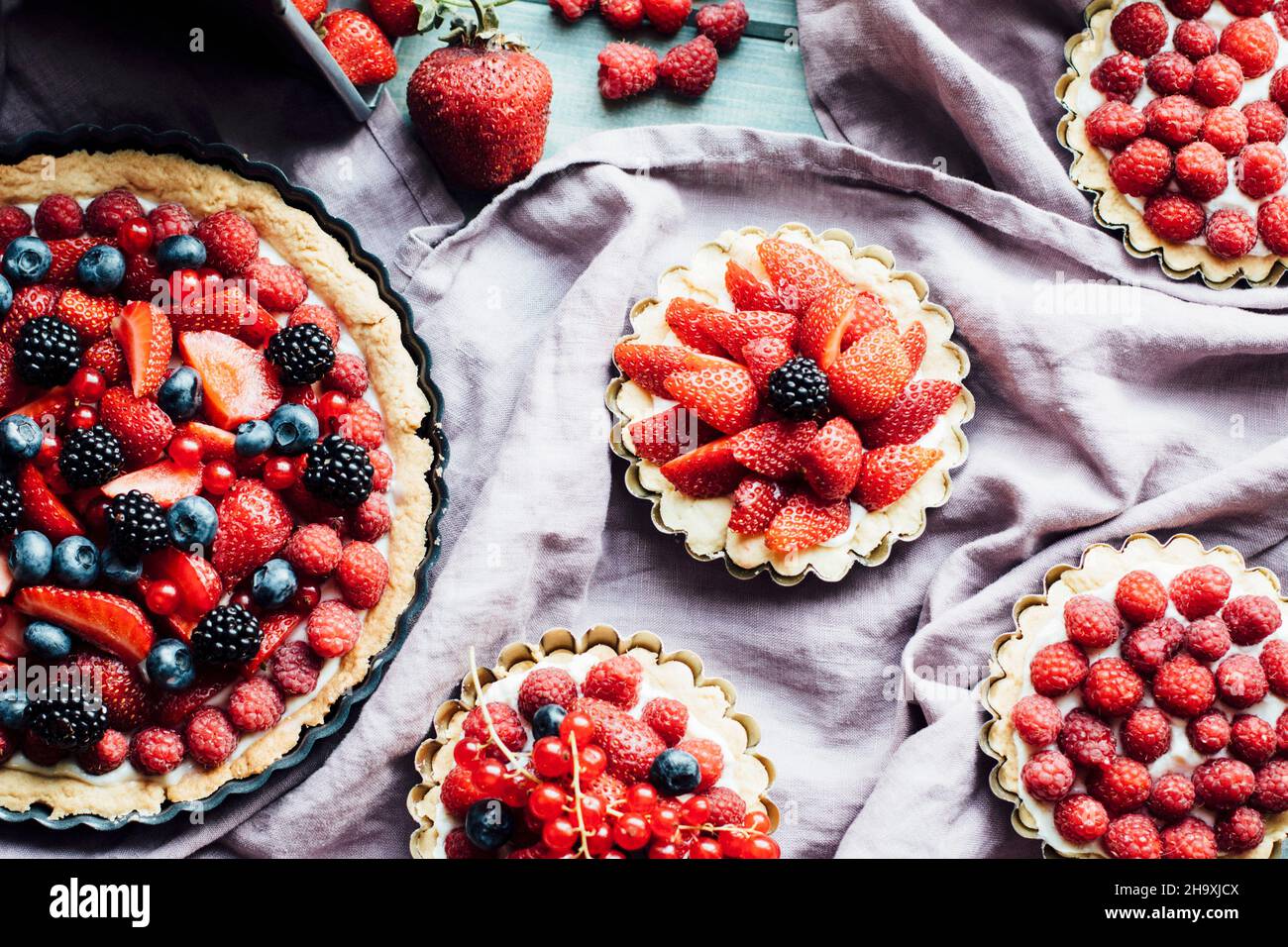Various berry tarts Stock Photo - Alamy