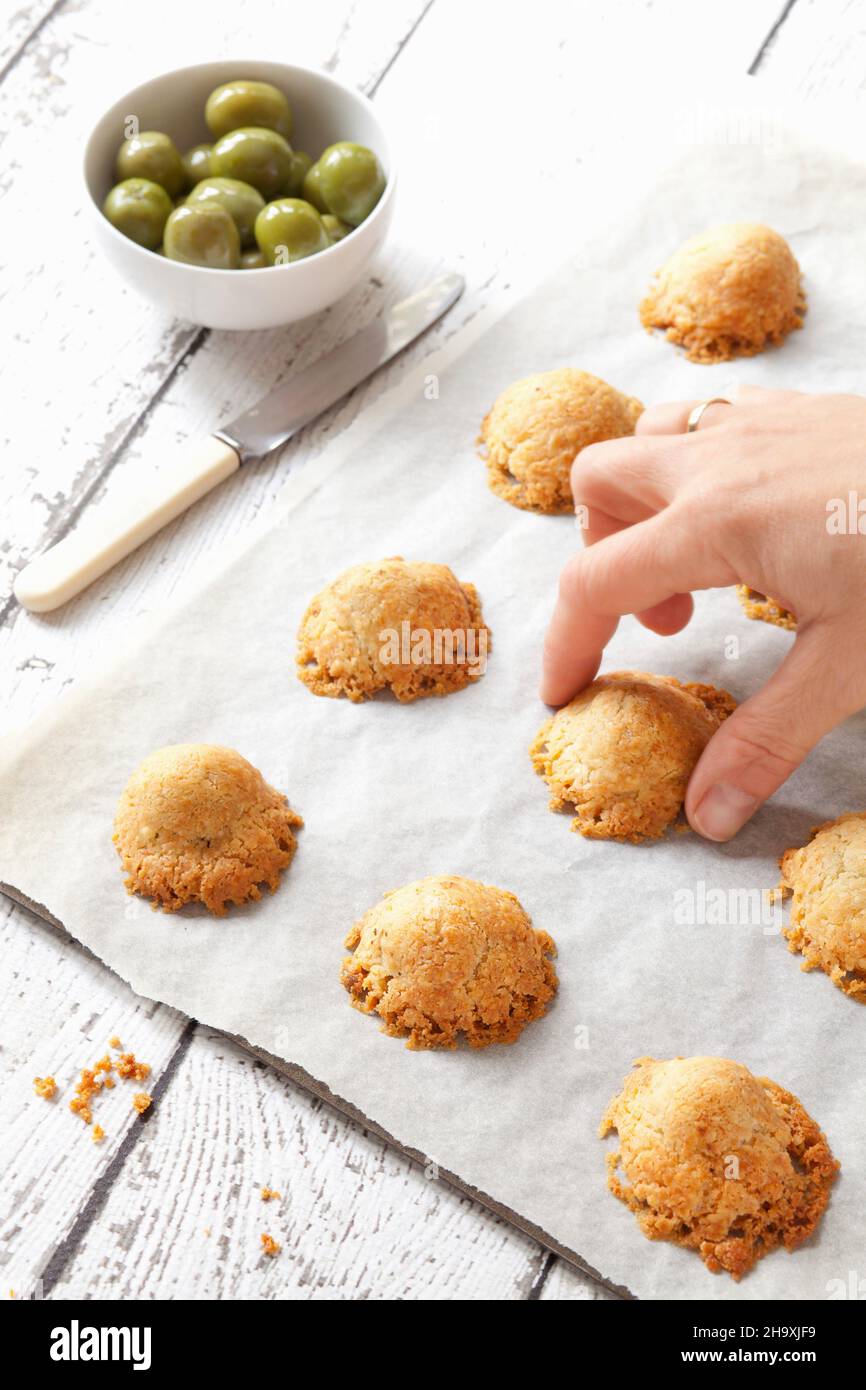 Baked cheese pastries on baking paper Stock Photo - Alamy