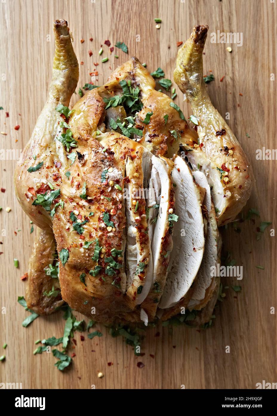 Chilli roast chicken with herbs Stock Photo - Alamy