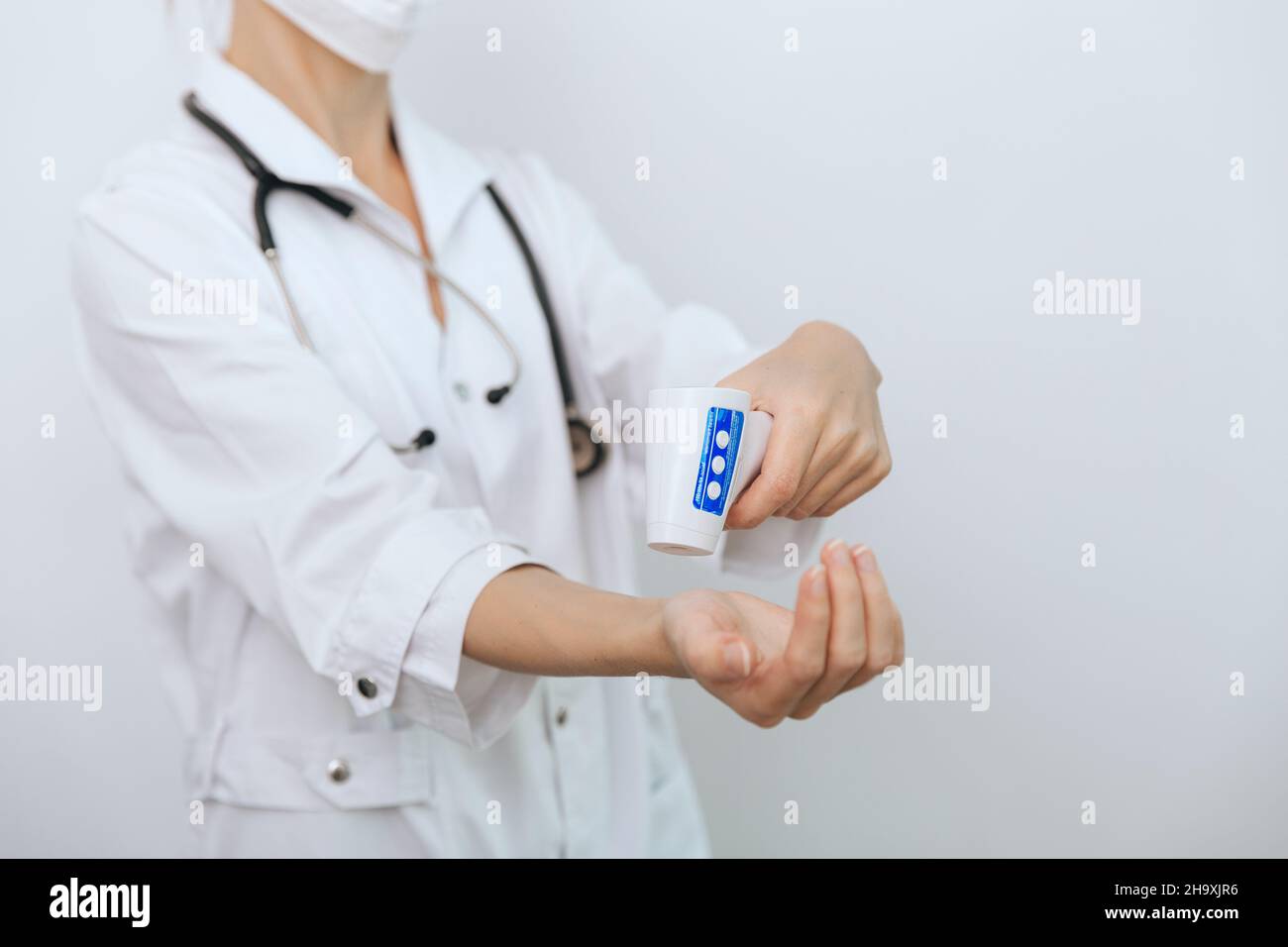 Temperature measurement gun in doctor hands. Close-up shot of doctor ...