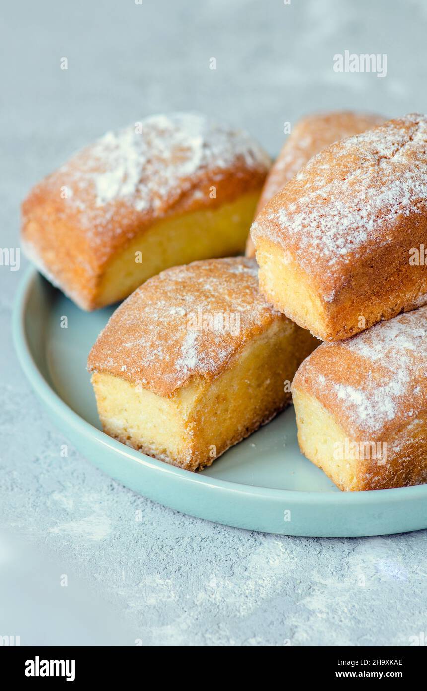 Mini loaf cakes with icing sugar Stock Photo - Alamy