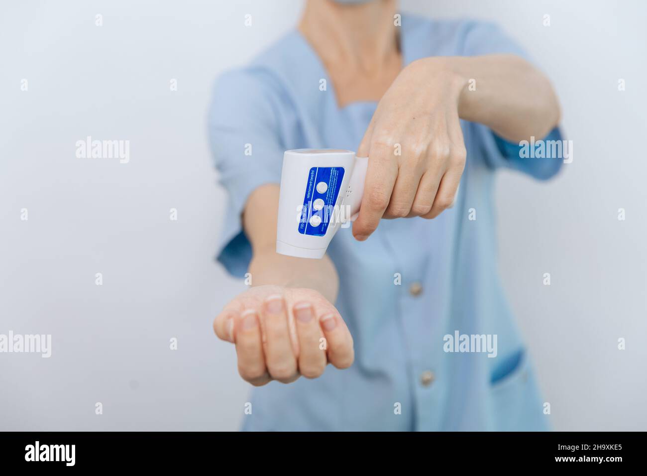 Temperature measurement gun in doctor hands. Close-up shot of doctor ...