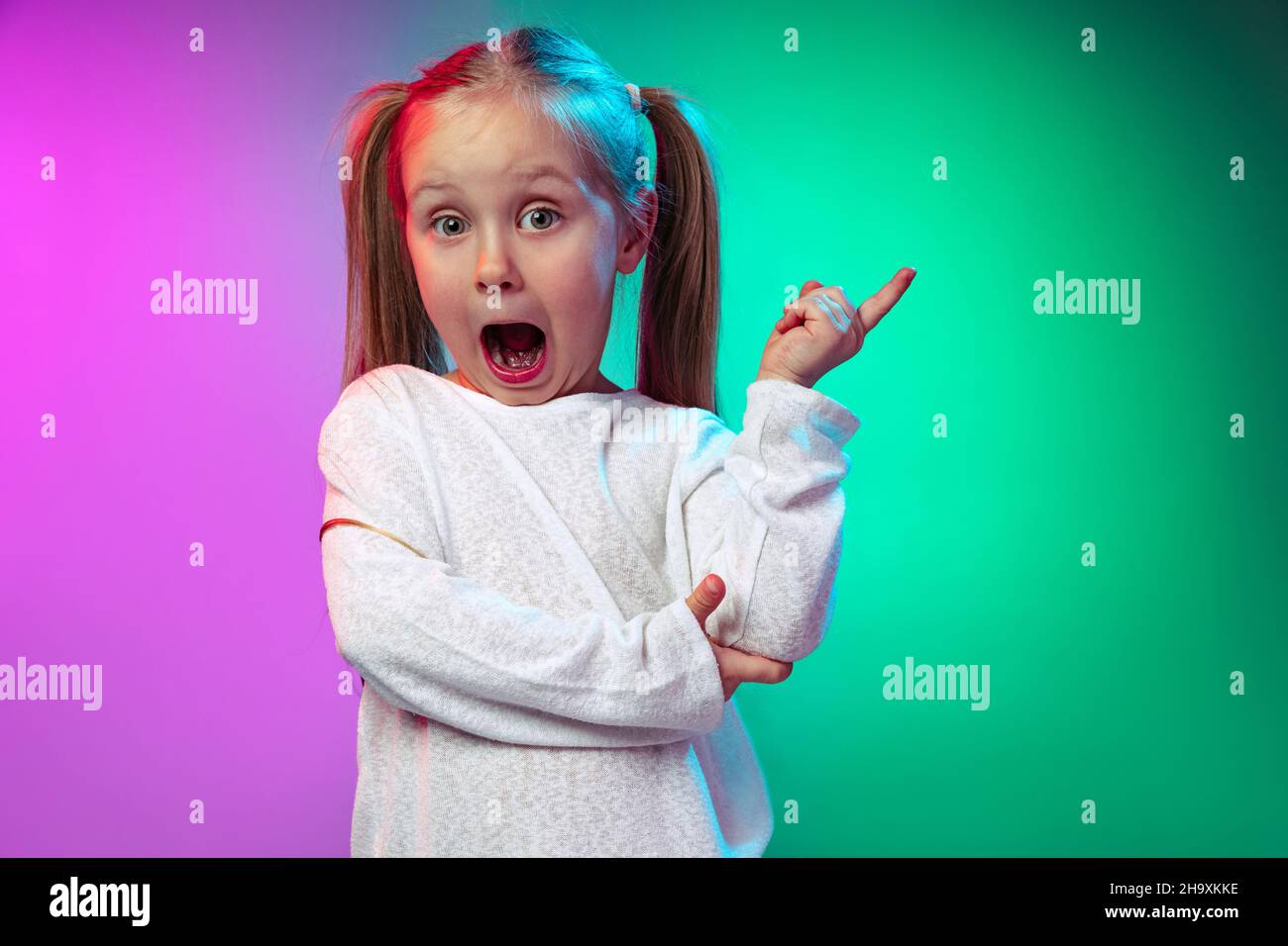 Portrait of little preschool girl, cute kid raising finger up isolated ...