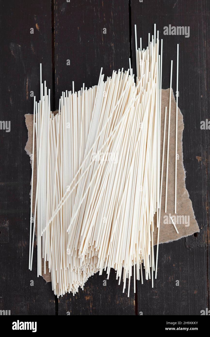 Shanghai noodles on a dark grey wooden table Stock Photo - Alamy