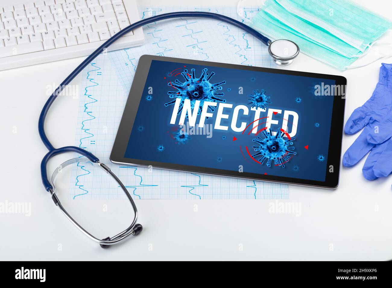 Tablet pc and doctor tools on white surface Stock Photo - Alamy