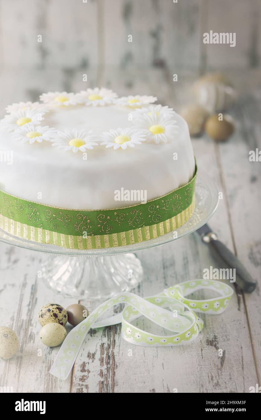 Easter cake with white icing flowers Stock Photo - Alamy