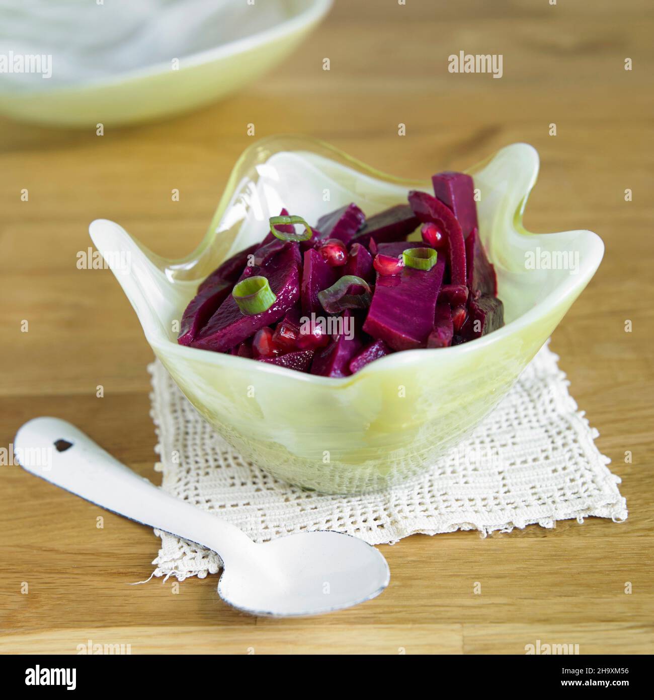 Beetroot salad with pomegranate seeds and spring onions Stock Photo - Alamy