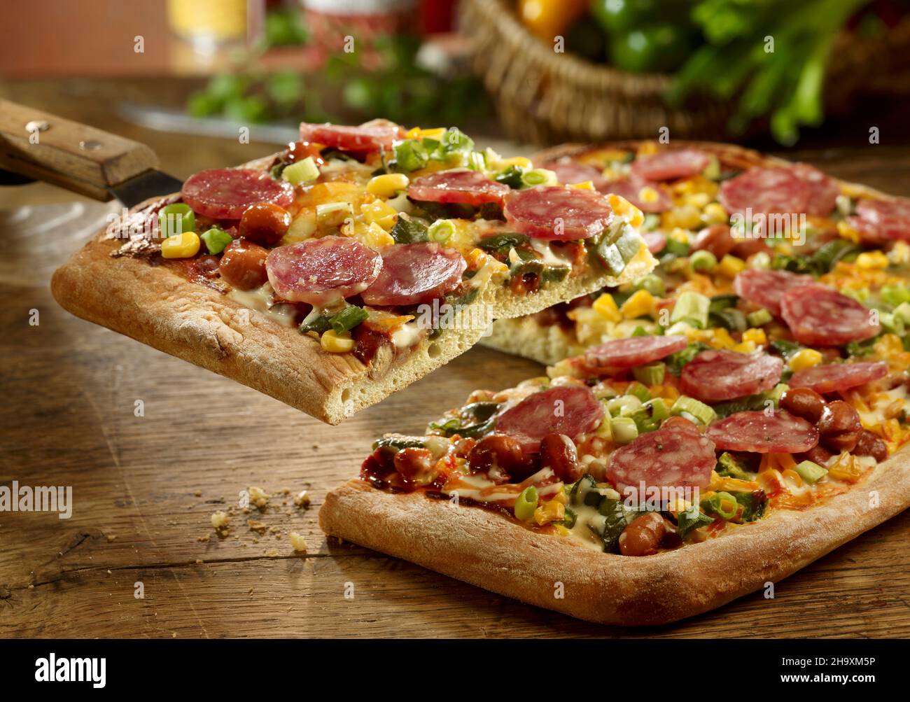A pepper, chilli and salami pizza Stock Photo - Alamy
