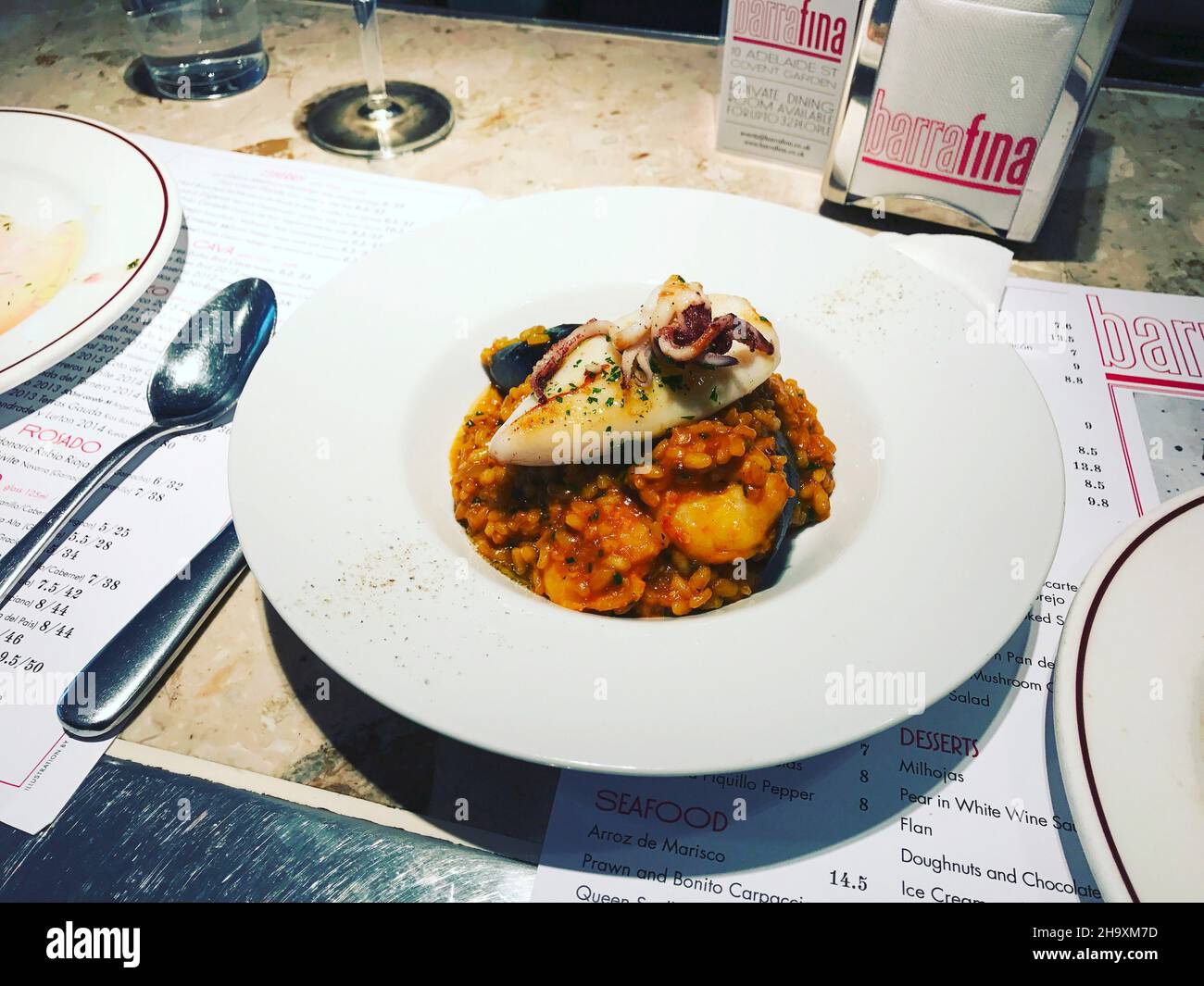 Rice with seafood in a restaurant Stock Photo - Alamy