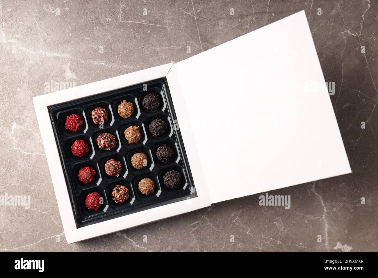Concept of sweets with chocolate candies on textured background Stock ...