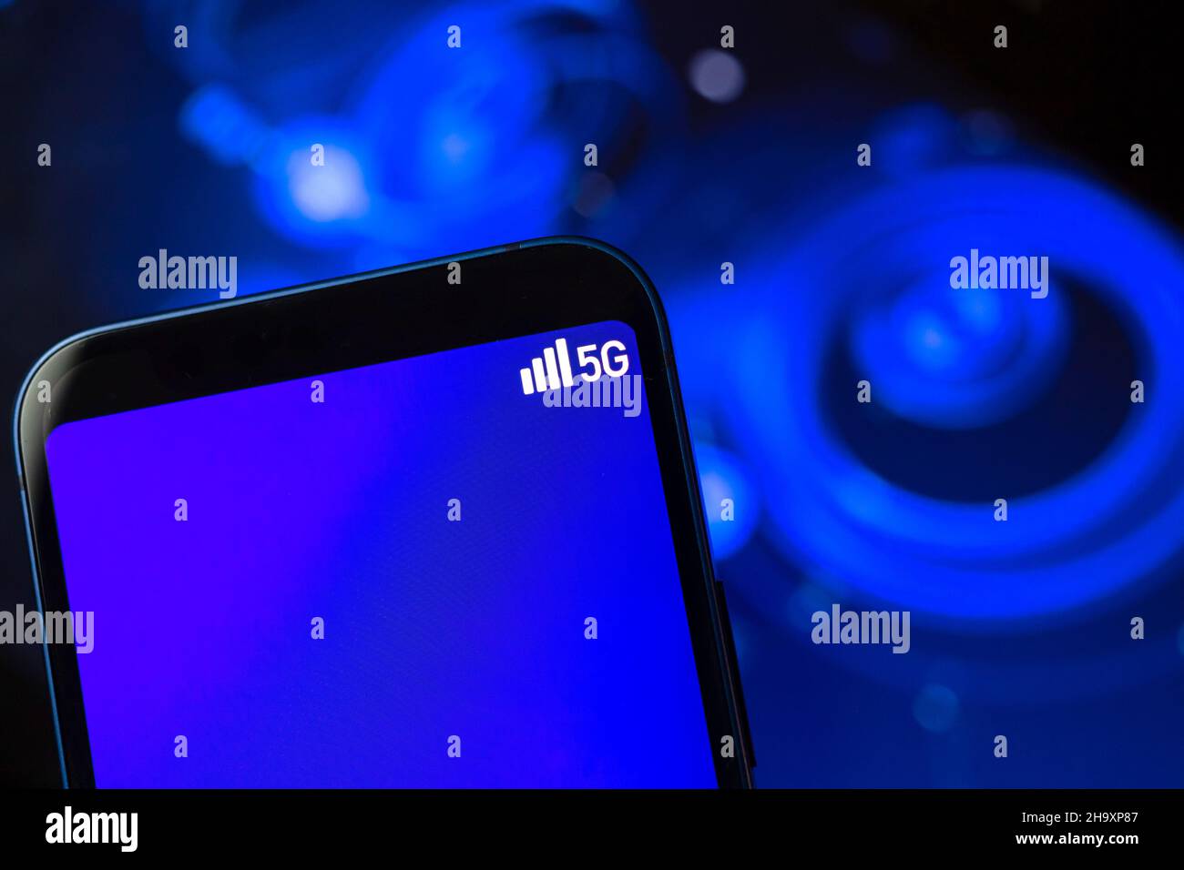 Mobile phone connected to 5G network wireless system. Concept photo of ...