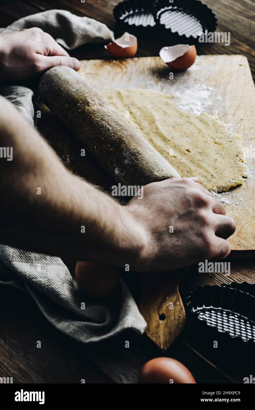 Hands man rolling out dough hi-res stock photography and images - Alamy