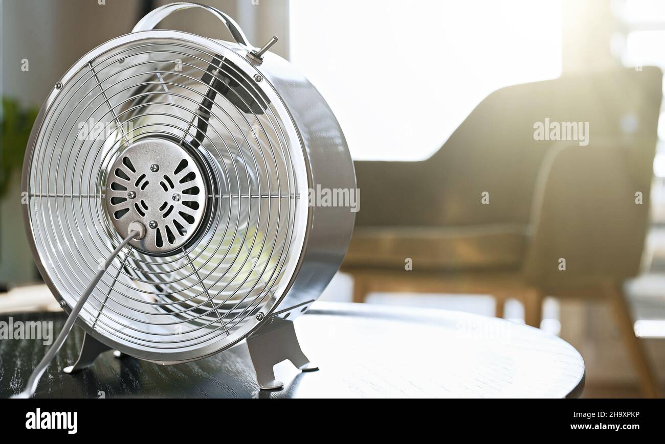Electric air fan rotates at home Stock Photo - Alamy