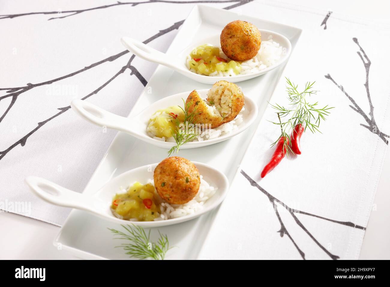 Cod balls in a fruity curry sauce on a bed of rice (Asia Stock Photo ...