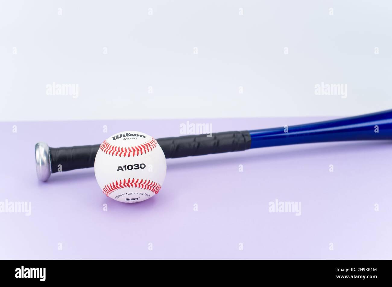 INVERIGO, ITALY - Dec 08, 2021: isolated baseball ball and bat on a ...