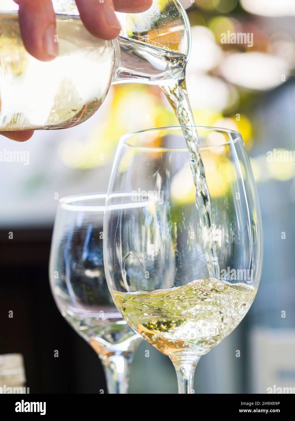 White South African wine being poured into a glass Stock Photo - Alamy