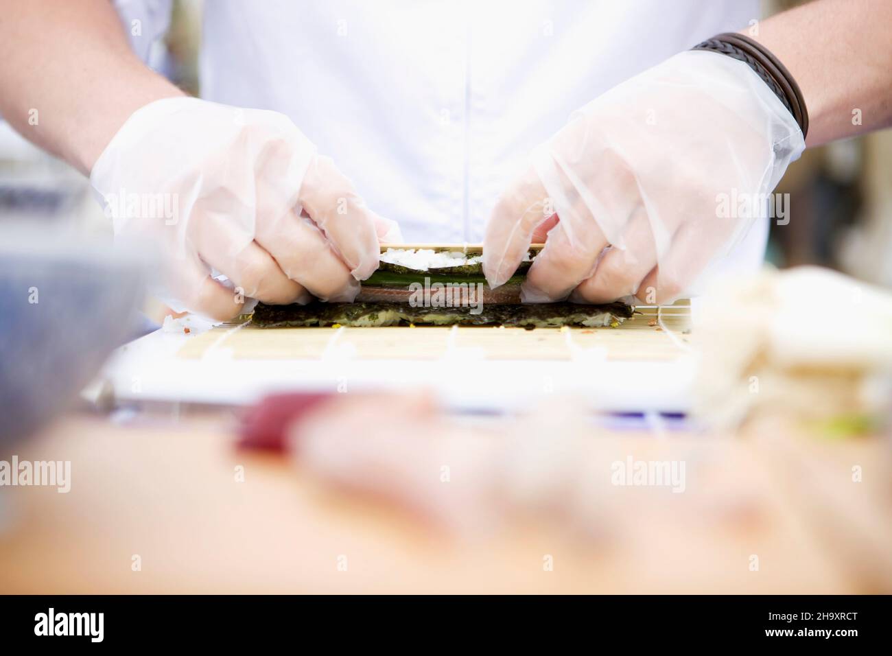 Rolling sushi people hi-res stock photography and images - Alamy