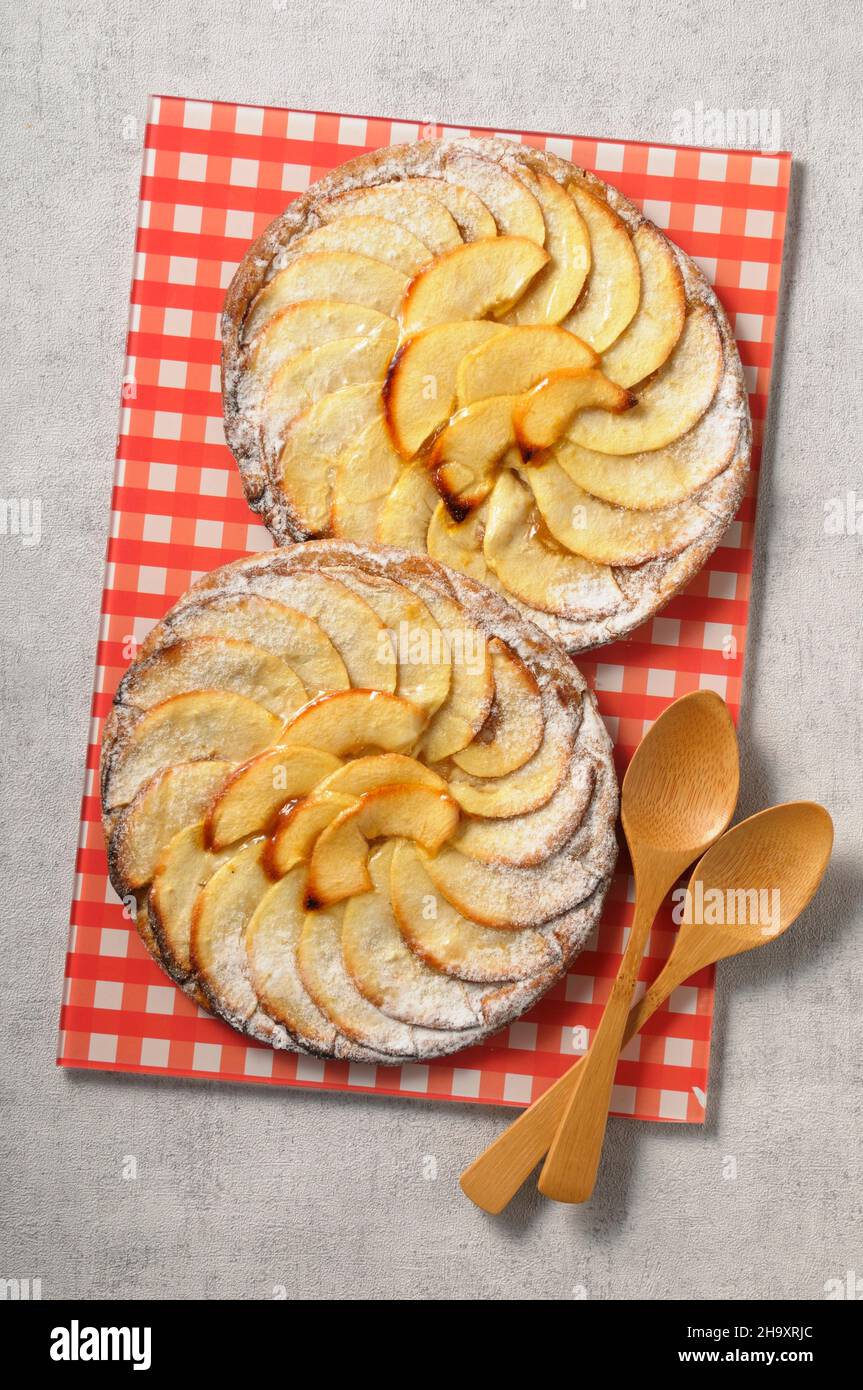 Apple tartlets with icing sugar Stock Photo - Alamy