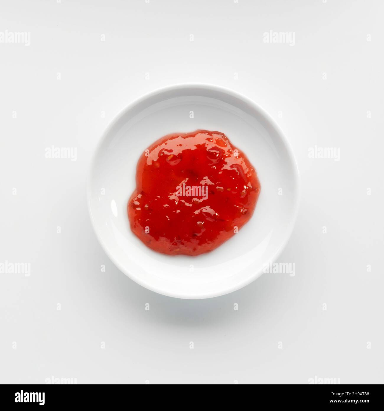 A portion of raspberry jam on a plate Stock Photo - Alamy