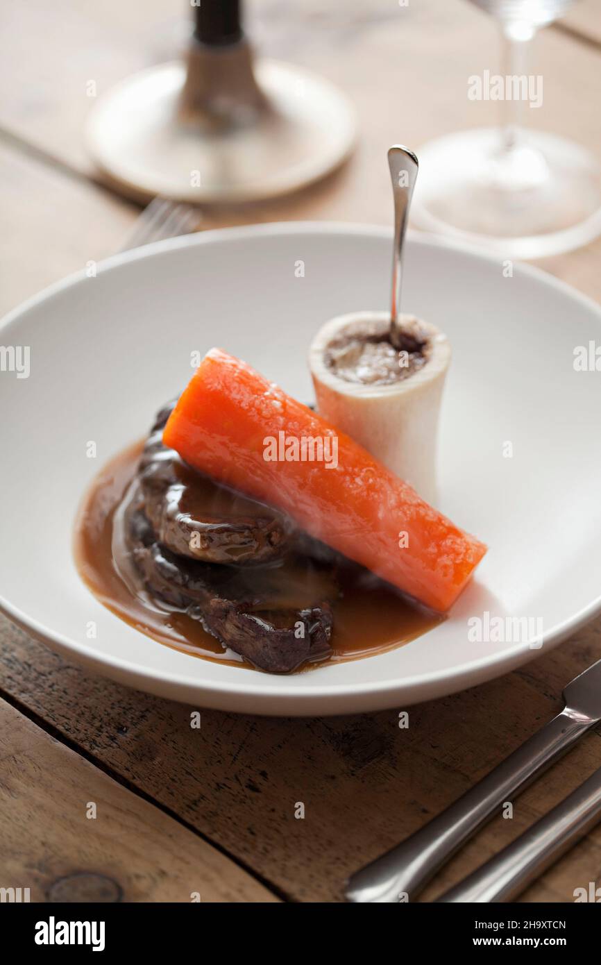 Bone Marrow served with meat and carrot Stock Photo - Alamy