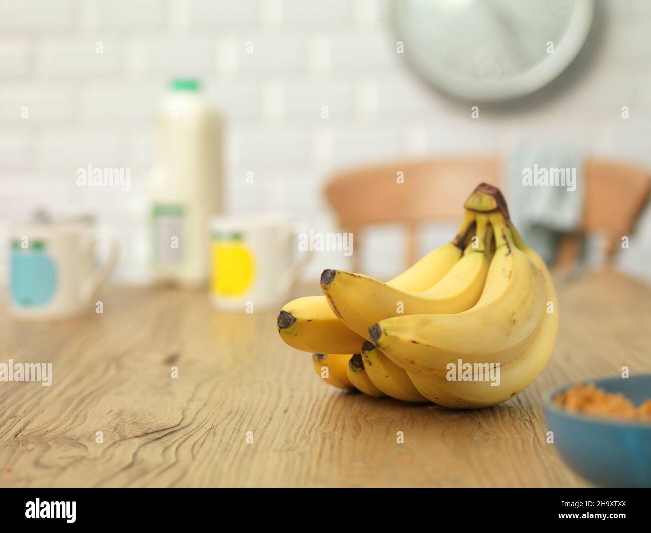 Bananas on a kitchen table Stock Photo - Alamy