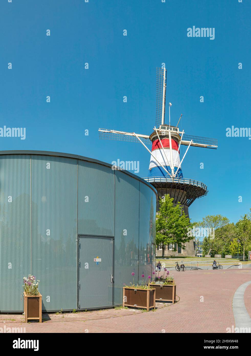 Windmill De Valk and a parking garage entrance Stock Photo - Alamy
