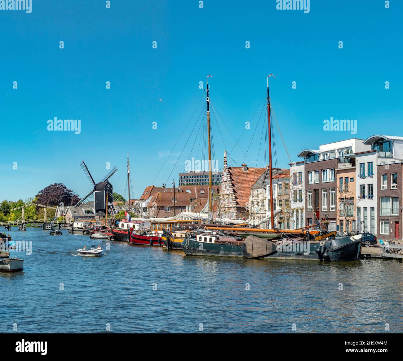 Windmill De Put and ships in the river Leidse rijn Stock Photo - Alamy