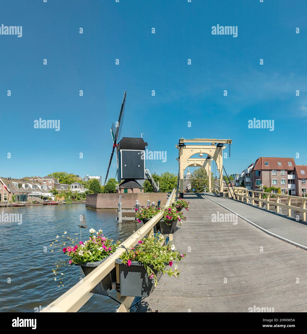 Double drawbridge towards the windmill called De Put Stock Photo - Alamy