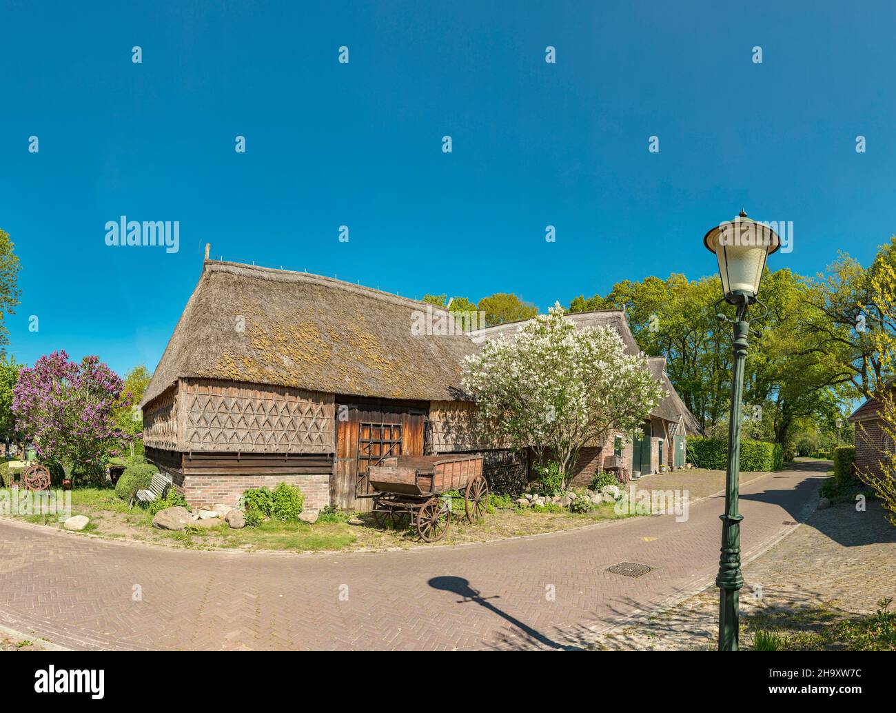 Farmhouses at a back road Stock Photo - Alamy