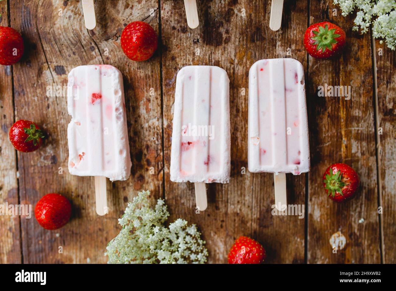 Buttermilk and strawberry ice lolly Stock Photo - Alamy