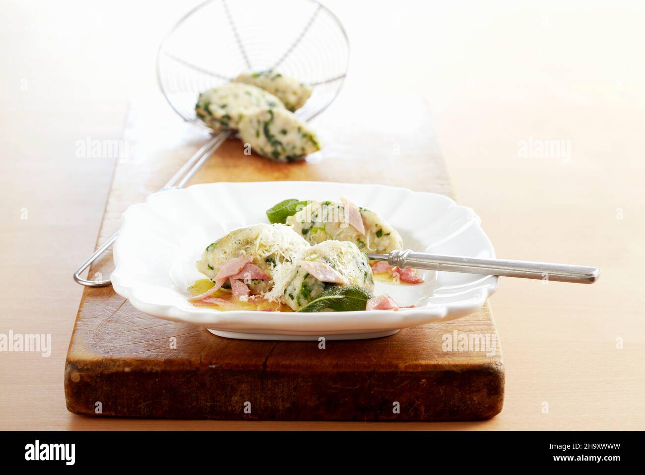 Roman spinach dumplings with sage and ham, Italy Stock Photo - Alamy