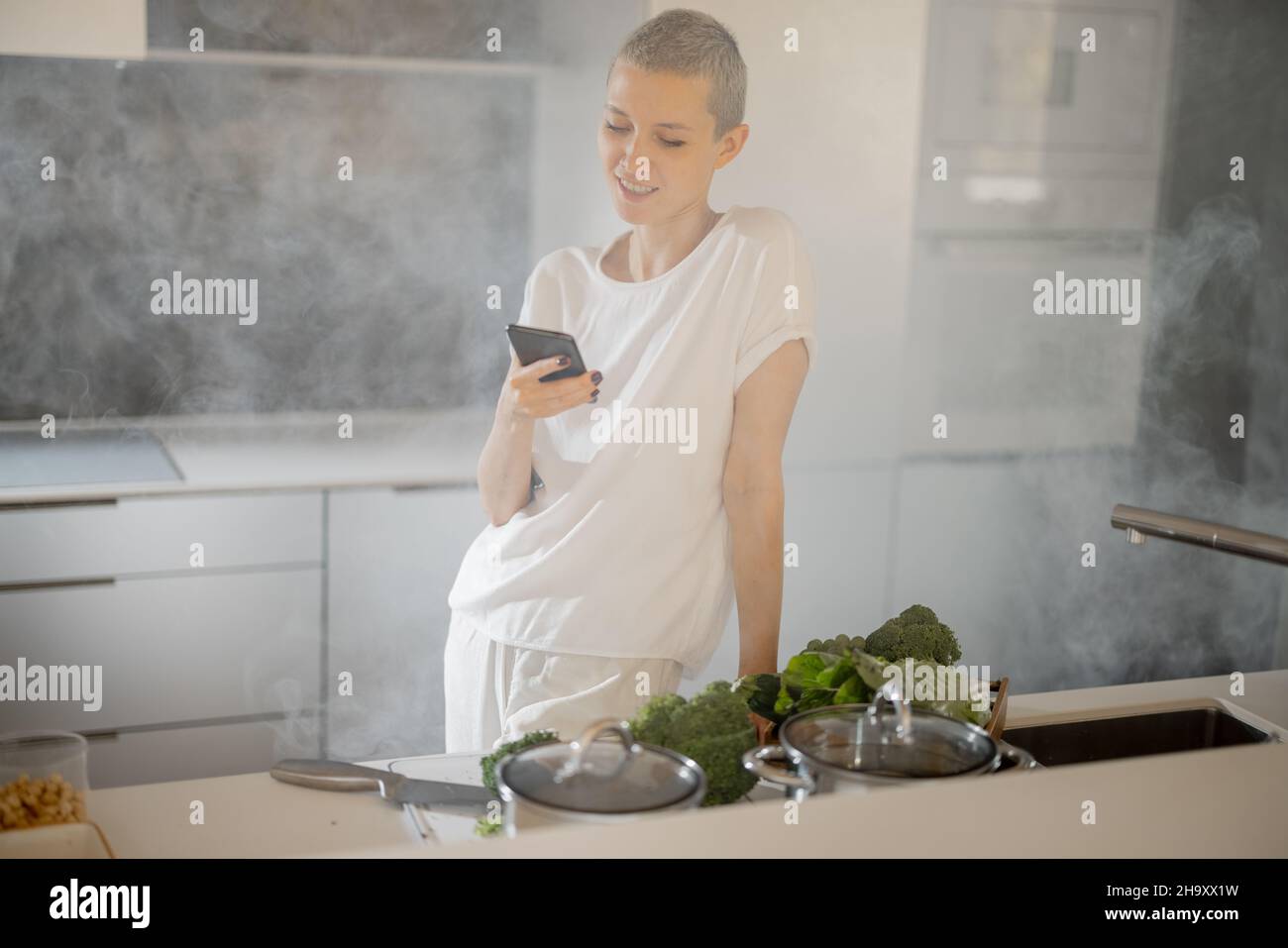 Woman cooking kitchen mess hi-res stock photography and images - Alamy
