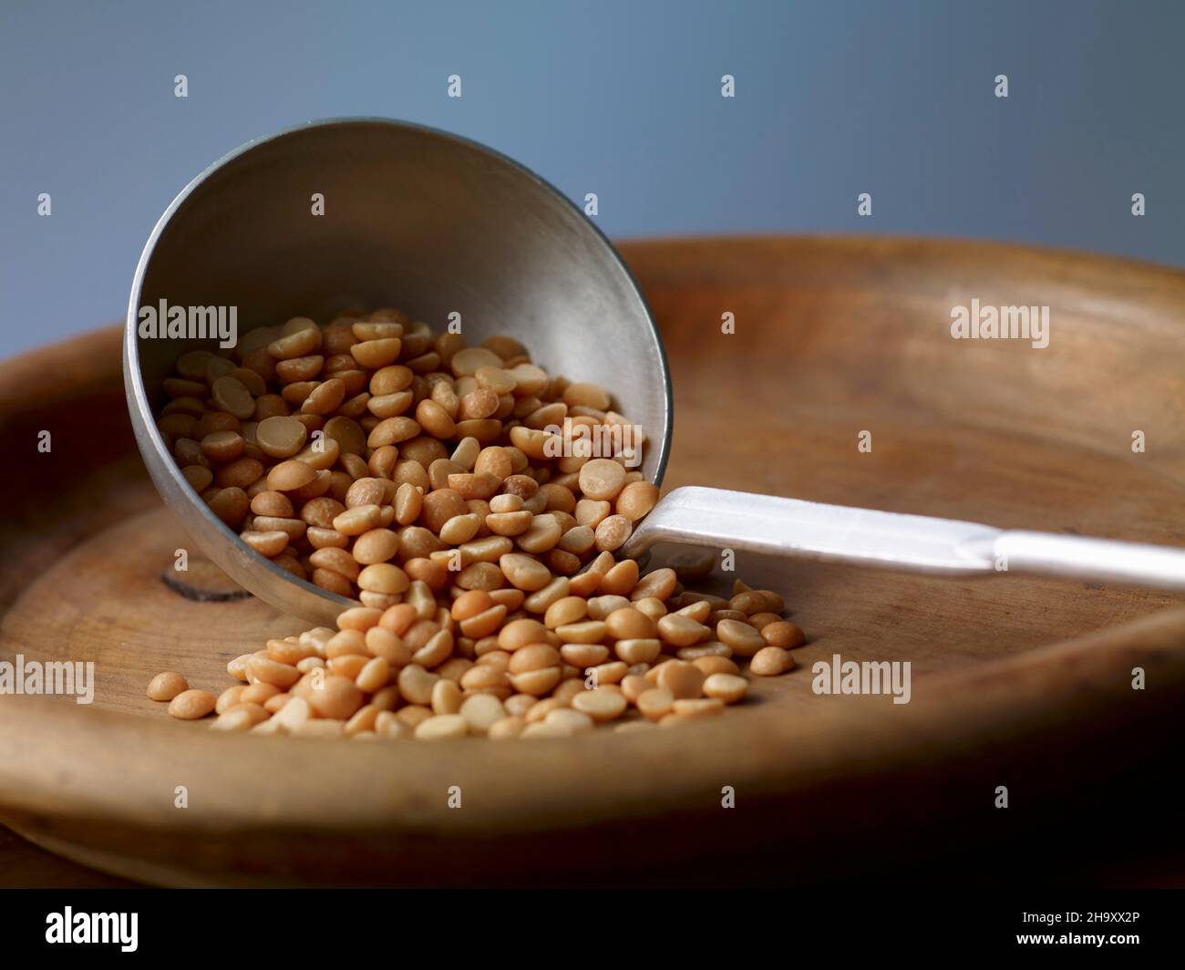 Yellow split peas on a ladle Stock Photo - Alamy