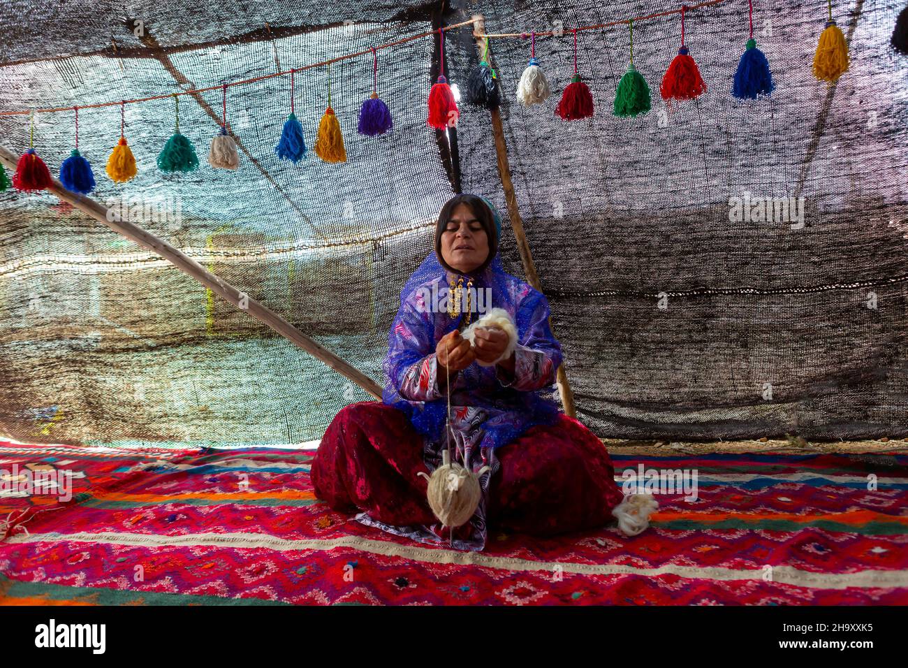 Shiraz, Iran - May 11, 2018: Qashqai nomadic women spinning wool ...