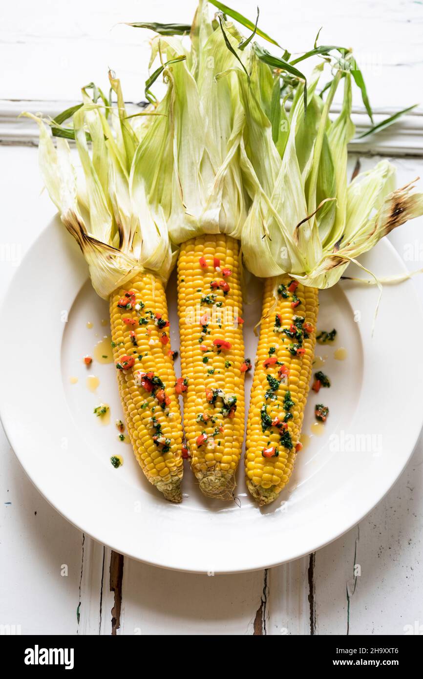 Corn on the cob with garlic and chilli butter Stock Photo - Alamy