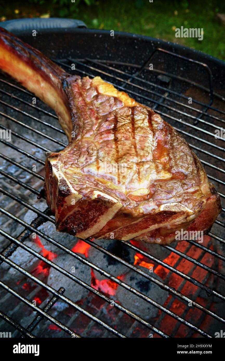 A grilled beef tomahawk steak Stock Photo - Alamy