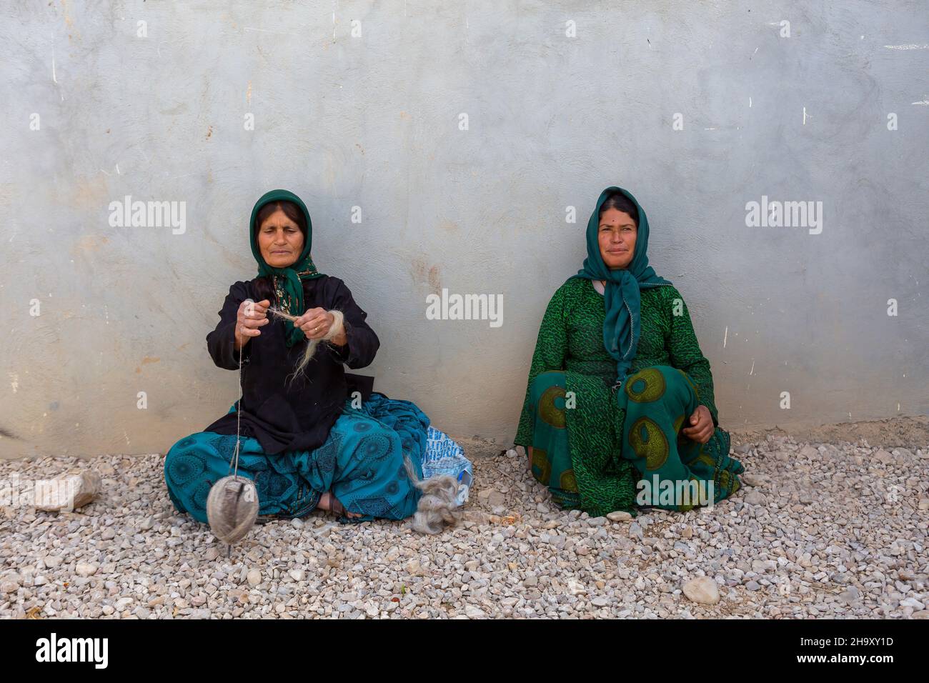 Shiraz, Iran - May 11, 2018: Qashqai nomadic women spinning wool ...
