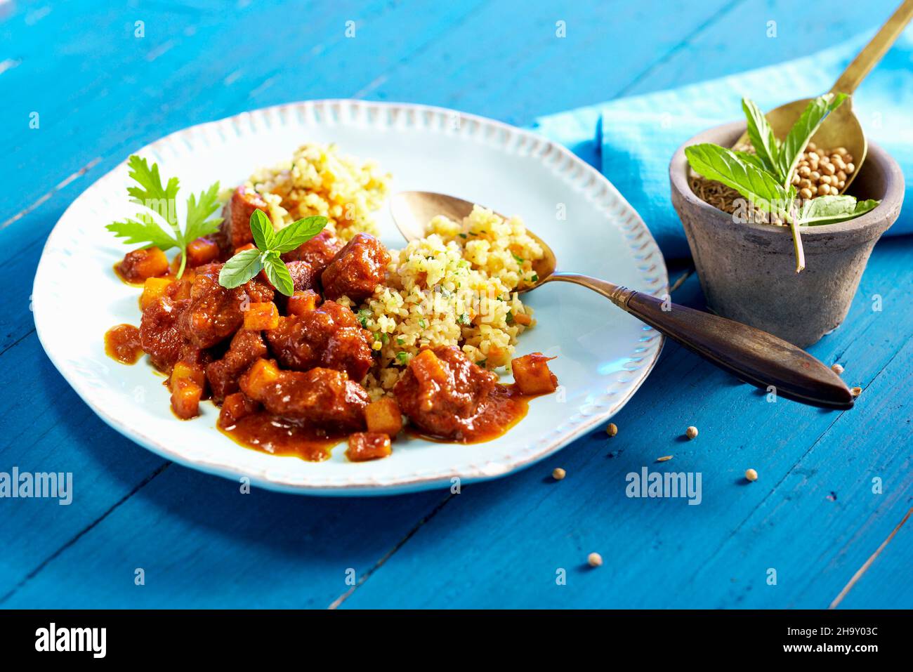 Lamb ragout with quinces and vegetable bulgur Stock Photo - Alamy