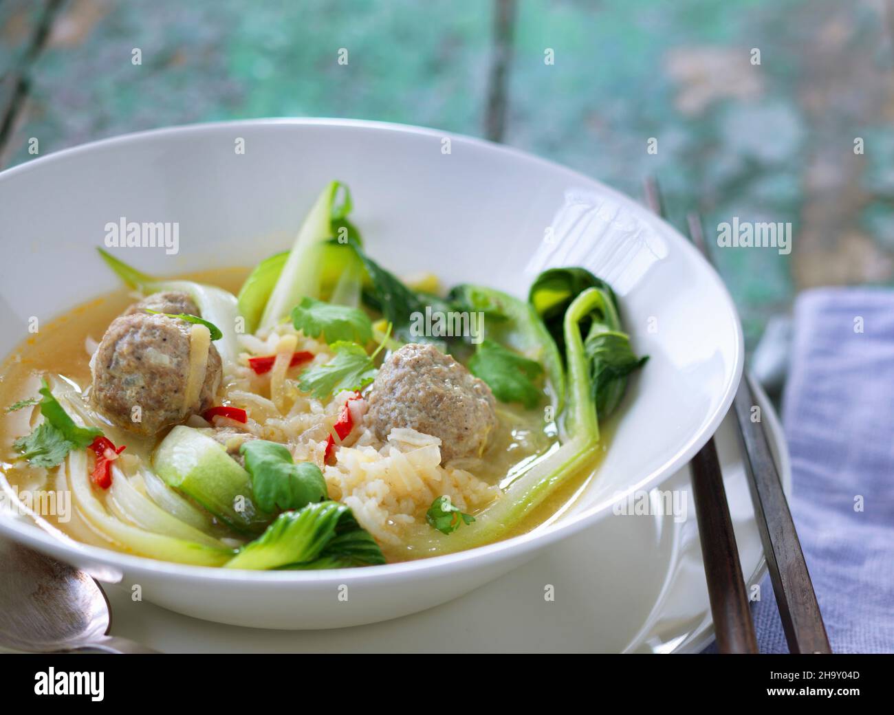 Oriental soup with bok choy, rice and beef meatballs Stock Photo - Alamy