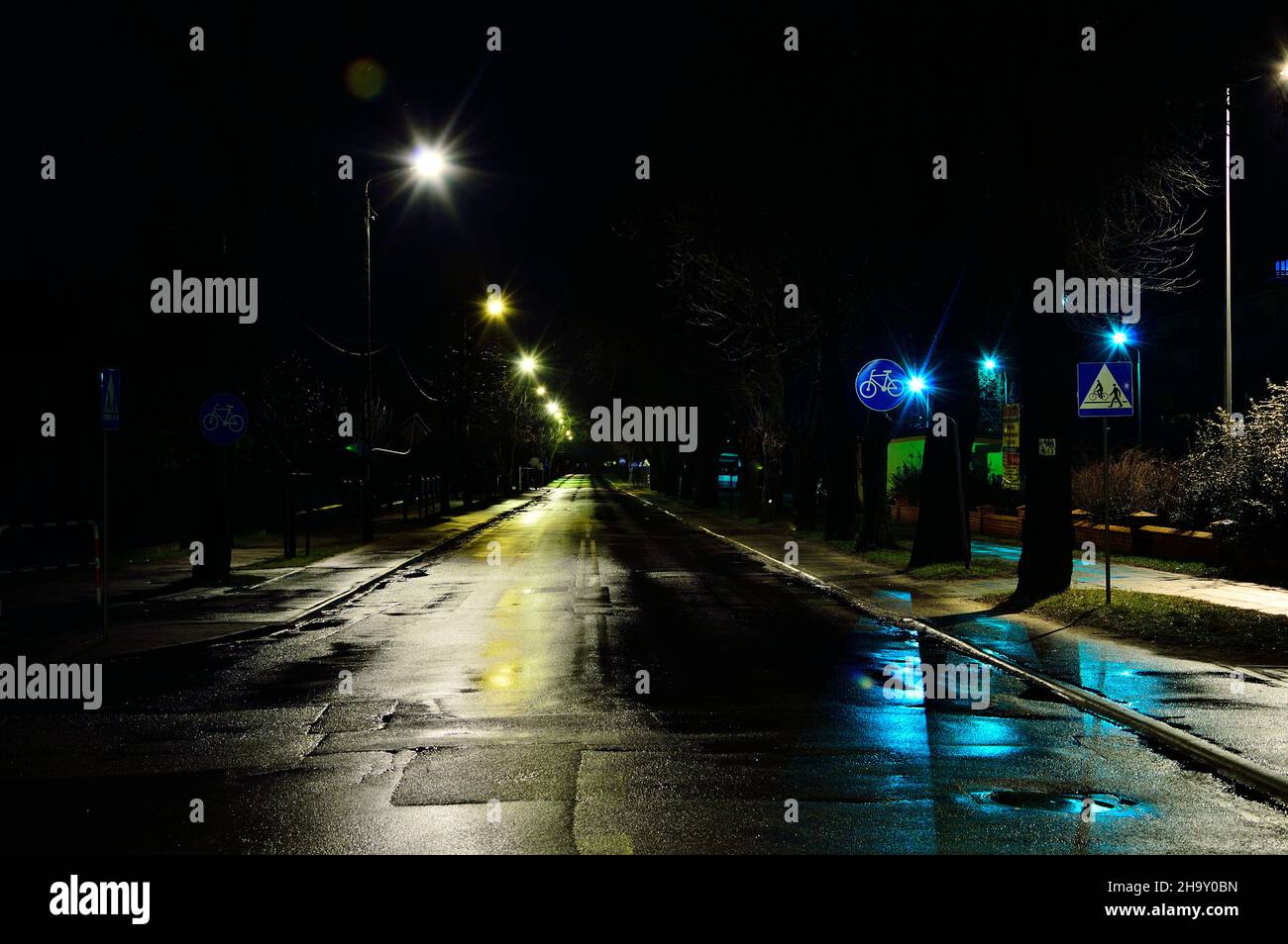 Streets after rain in a night city lit by street lamps. Rain Stock ...