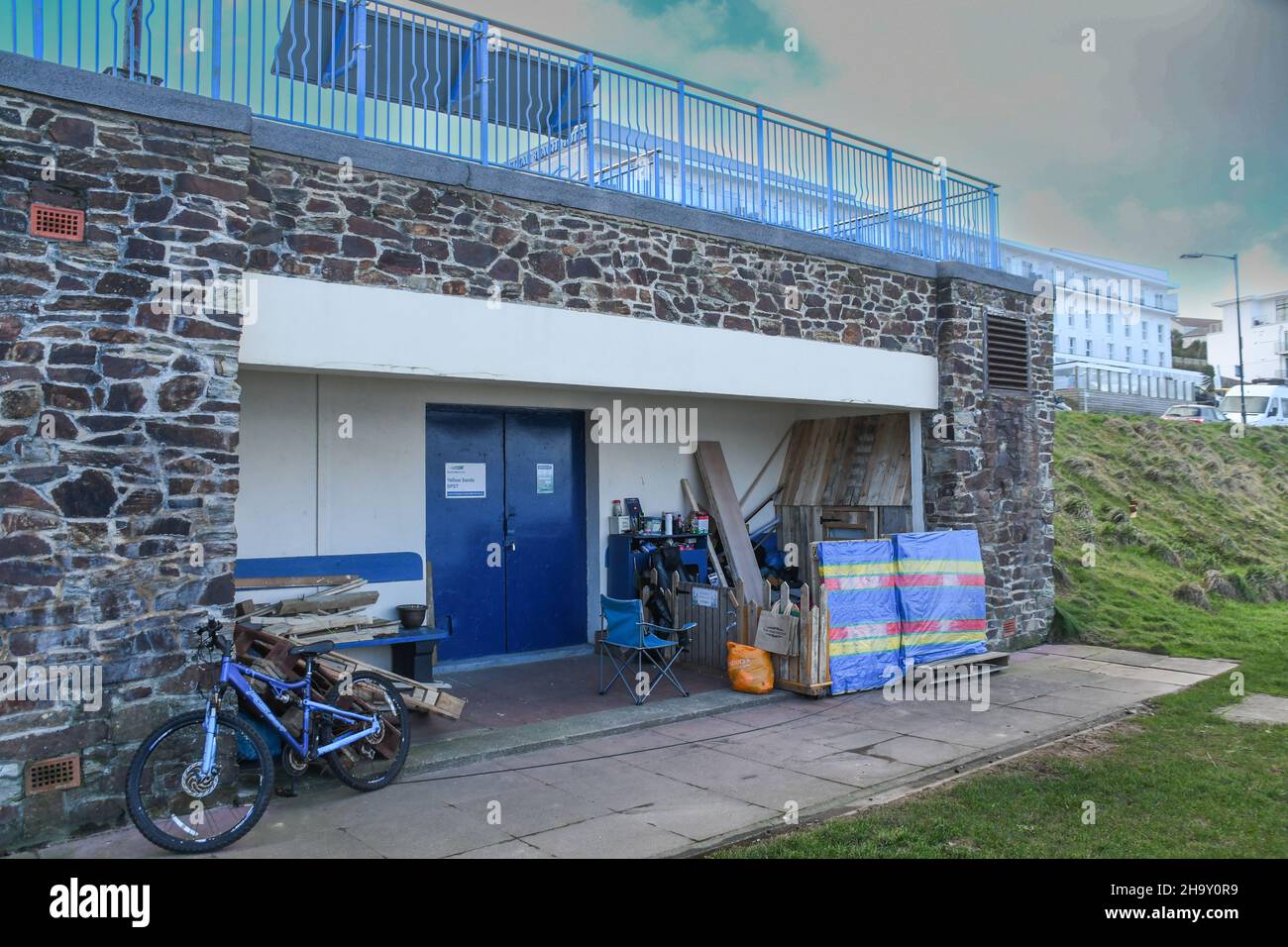 Homeless persons shelter underneath a utility building on the sea front ...
