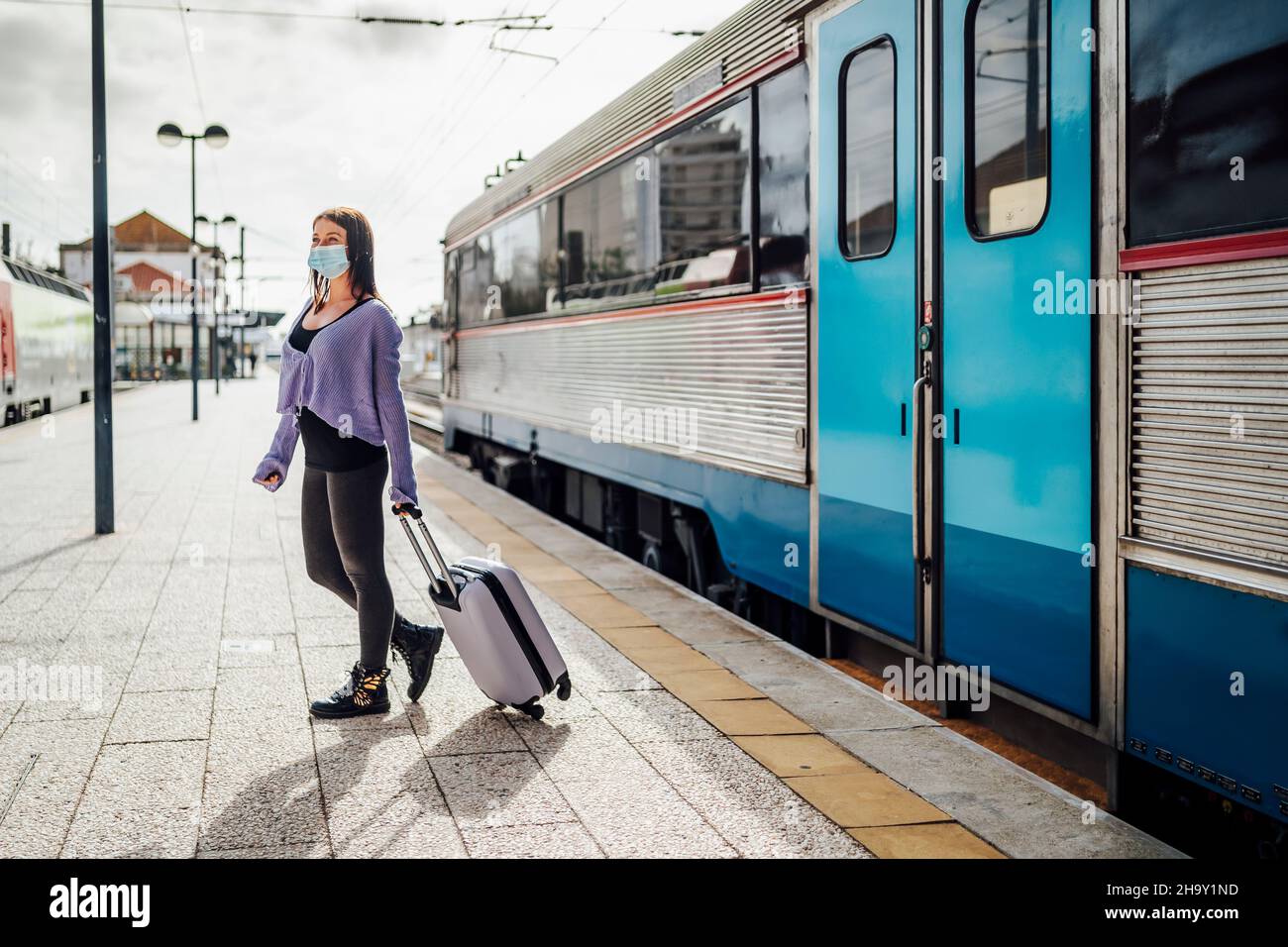 Young women left the train, standing on the platform ready for ...