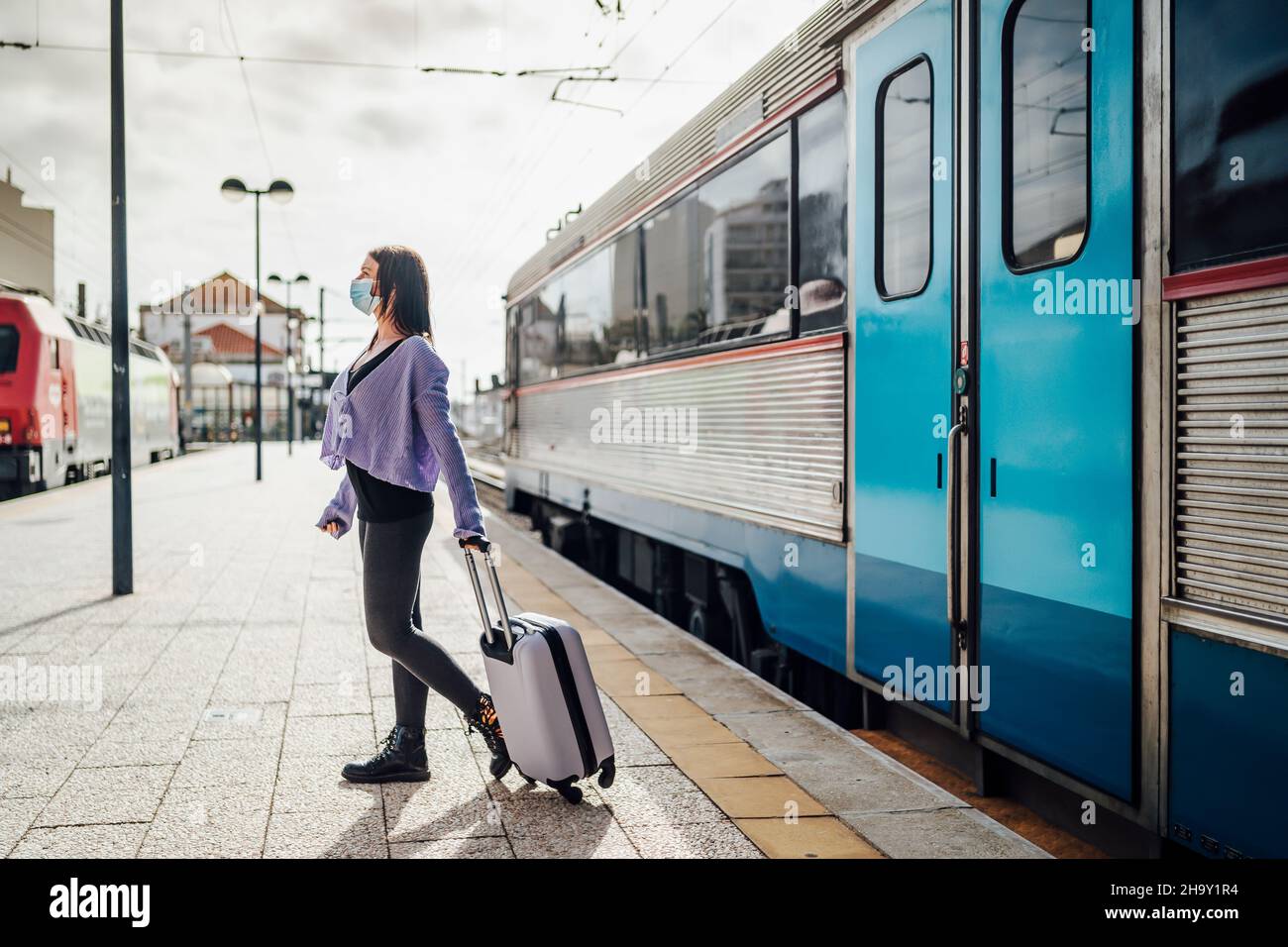Young women left the train, standing on the platform ready for ...